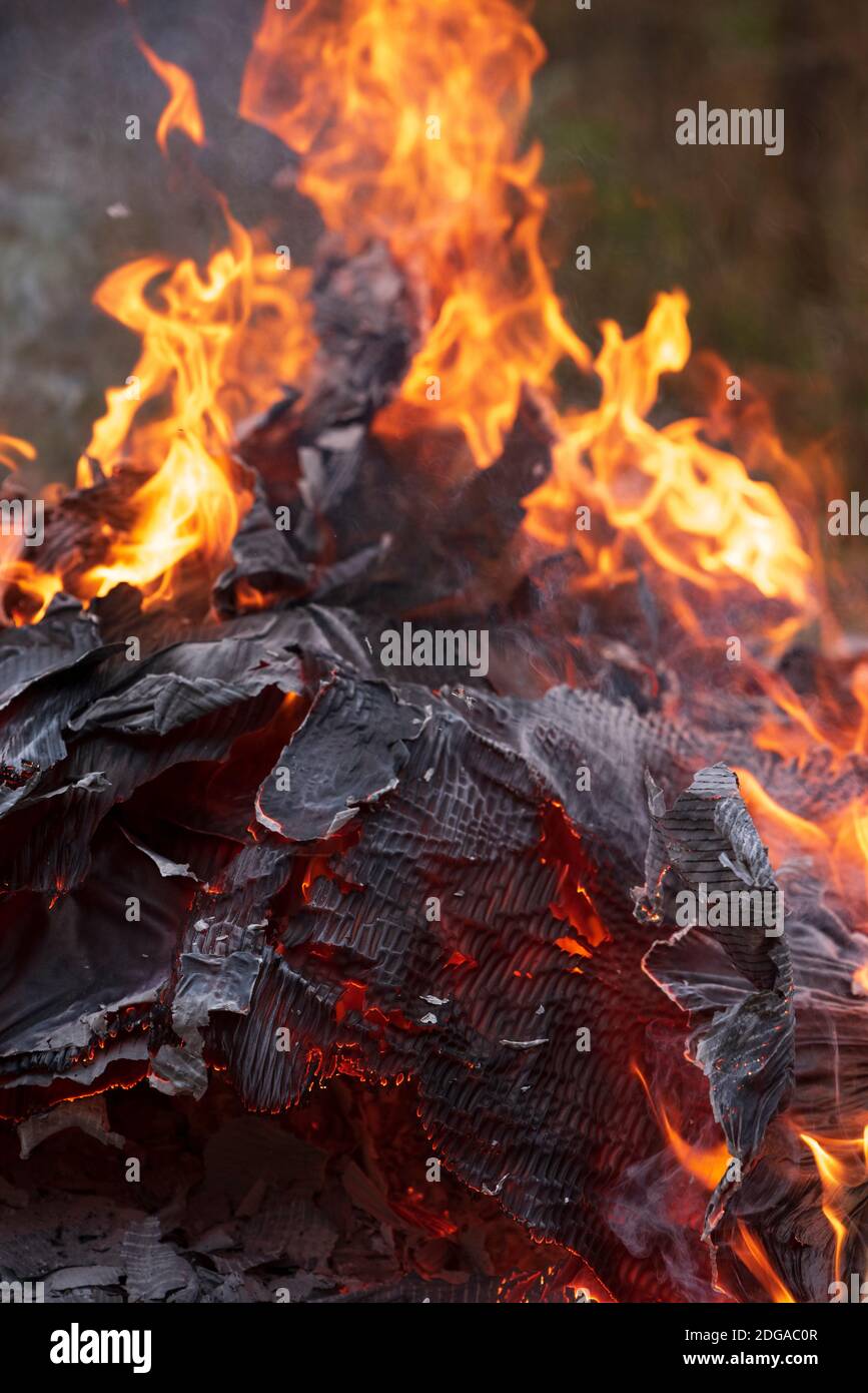 Pile of burning cardboard and waste paper Stock Photo - Alamy