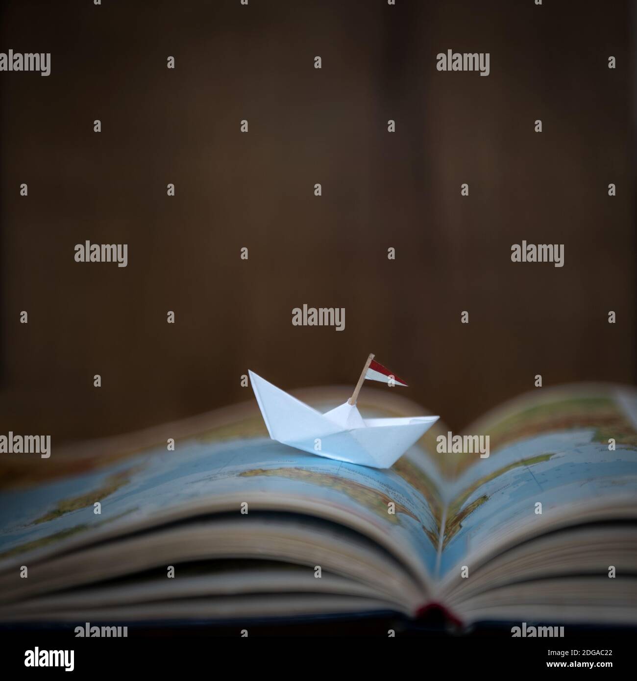 Paper Boat on Map Stock Photo - Alamy