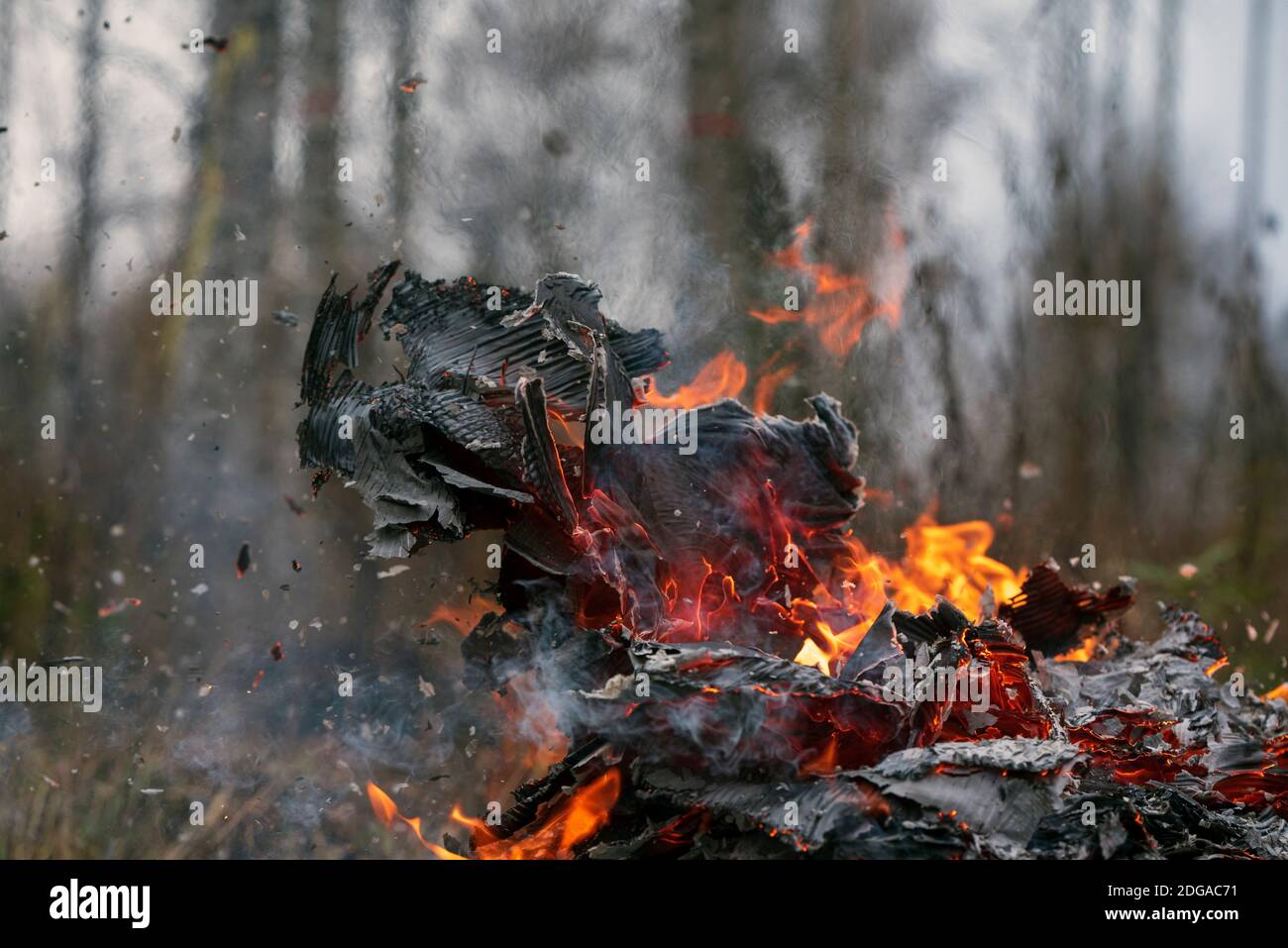 Pile of burning cardboard and waste paper Stock Photo - Alamy