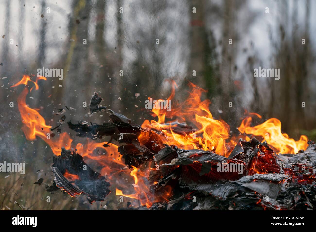 Pile of burning cardboard and waste paper Stock Photo - Alamy