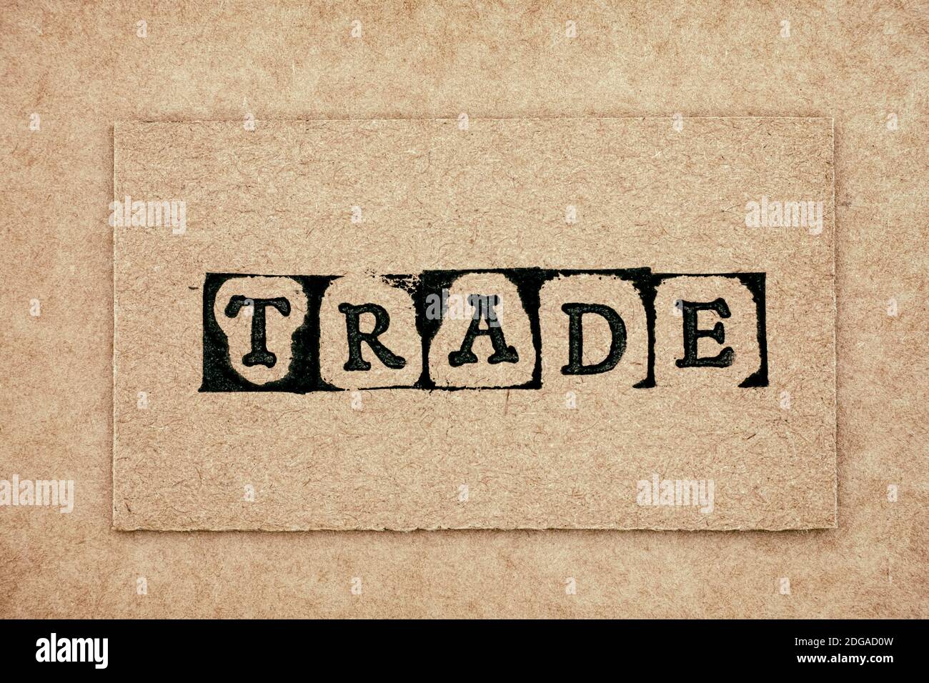 Cardboard with word Trade made by black alphabet stamps Stock Photo - Alamy