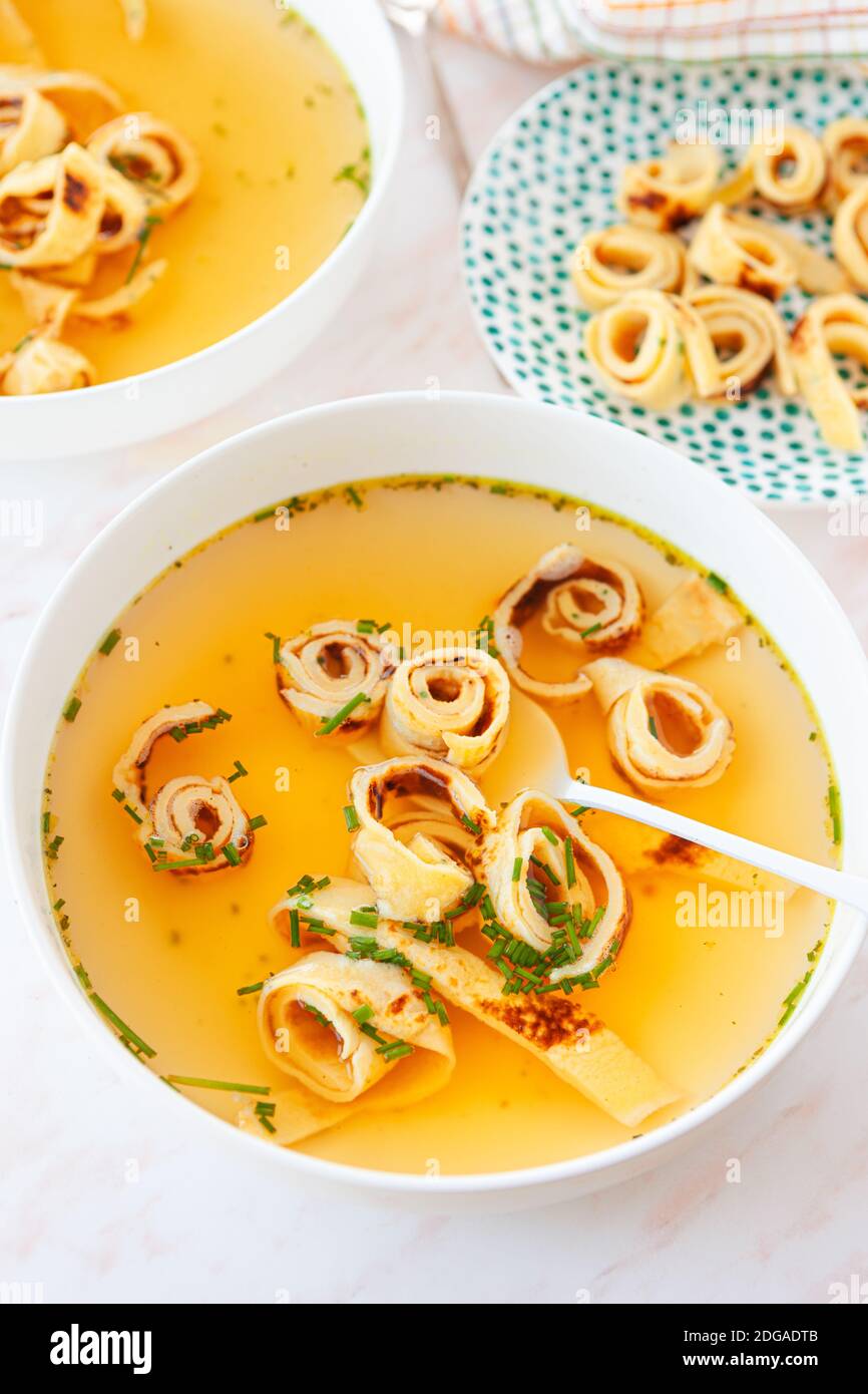 Typical German pancake soup with fresh chives Stock Photo - Alamy