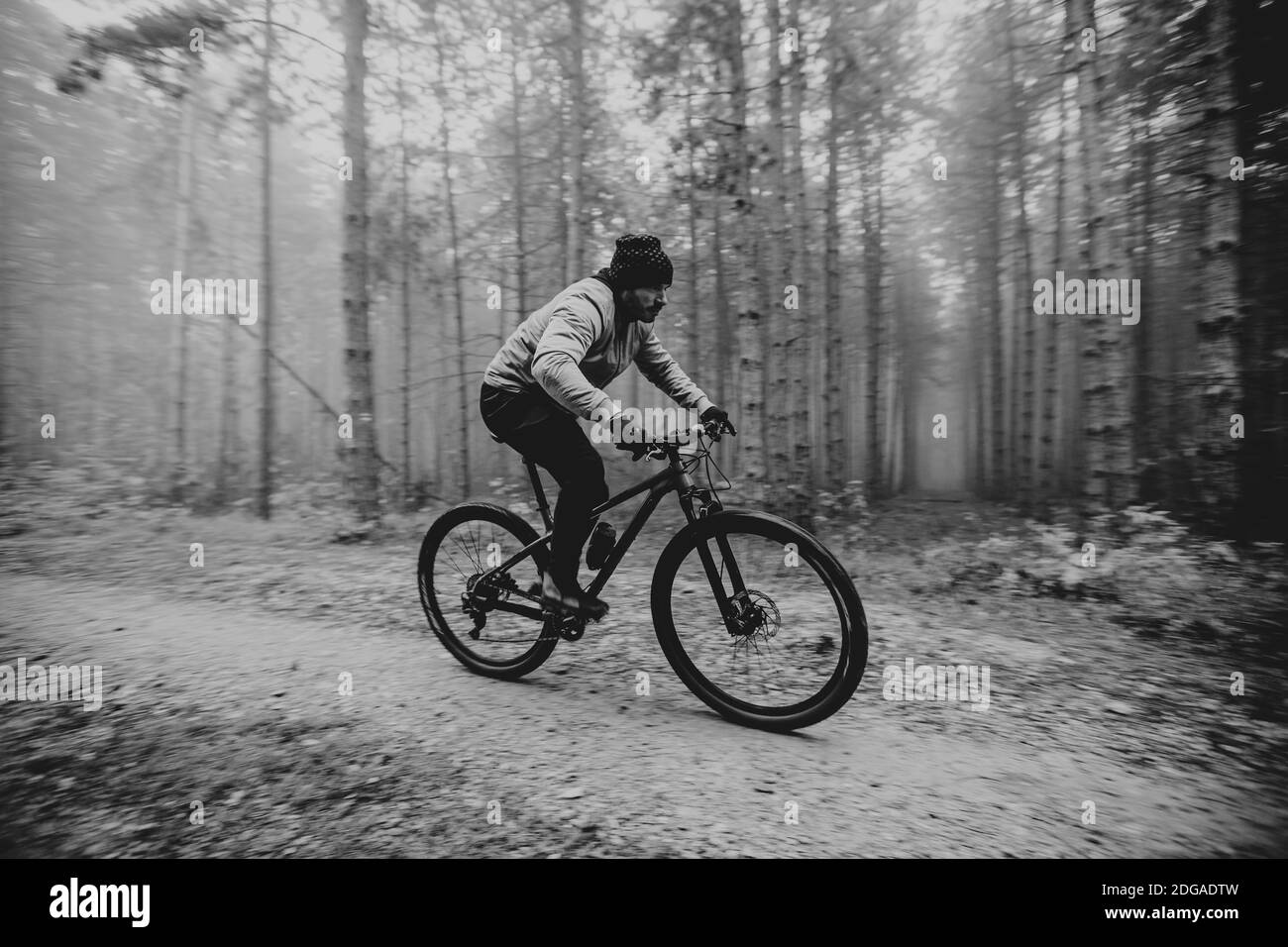Handsome male riding bicycle Black and White Stock Photos & Images - Alamy