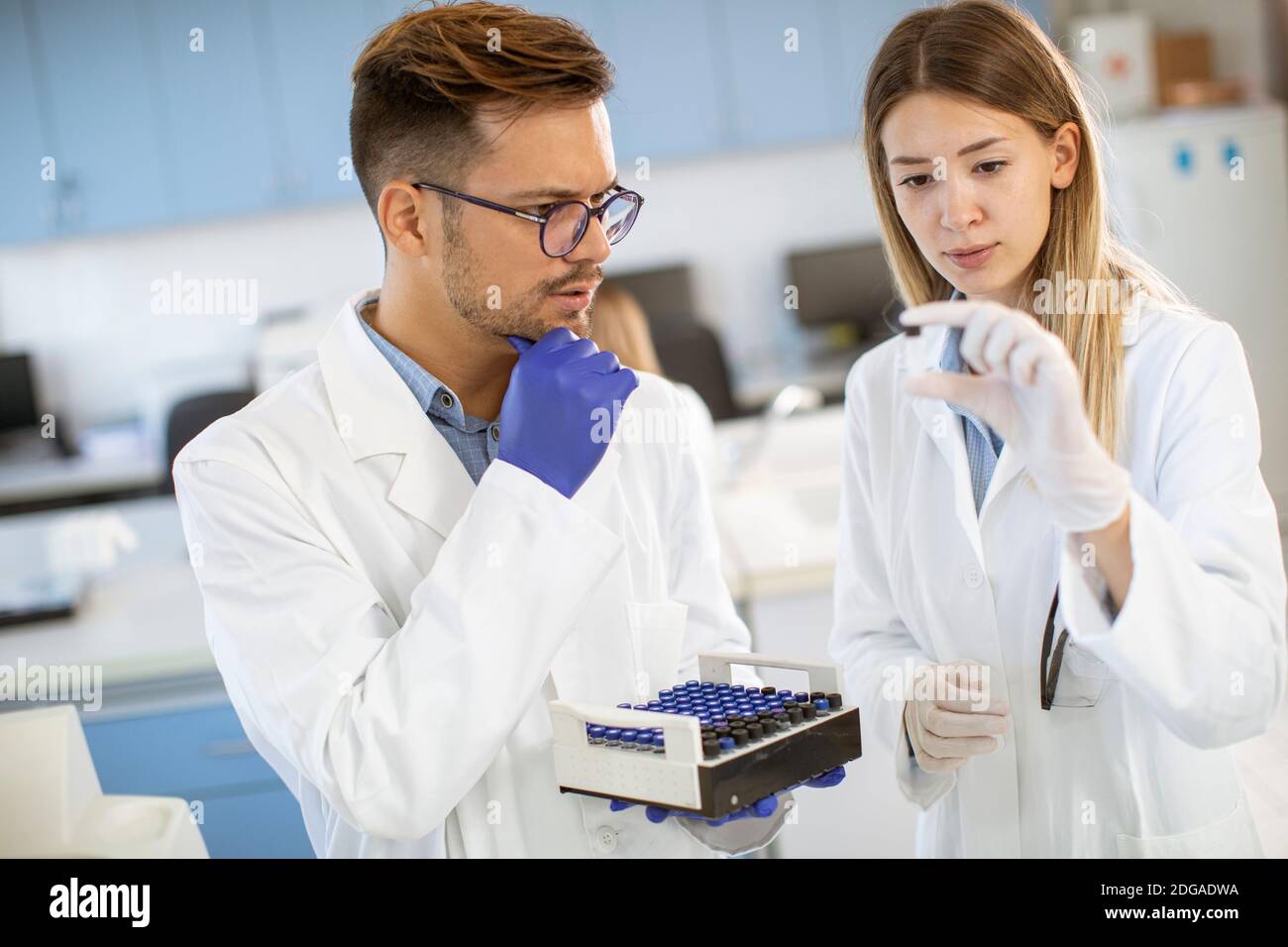 Young researchers analyzing chemical data in the laboratory Stock Photo ...