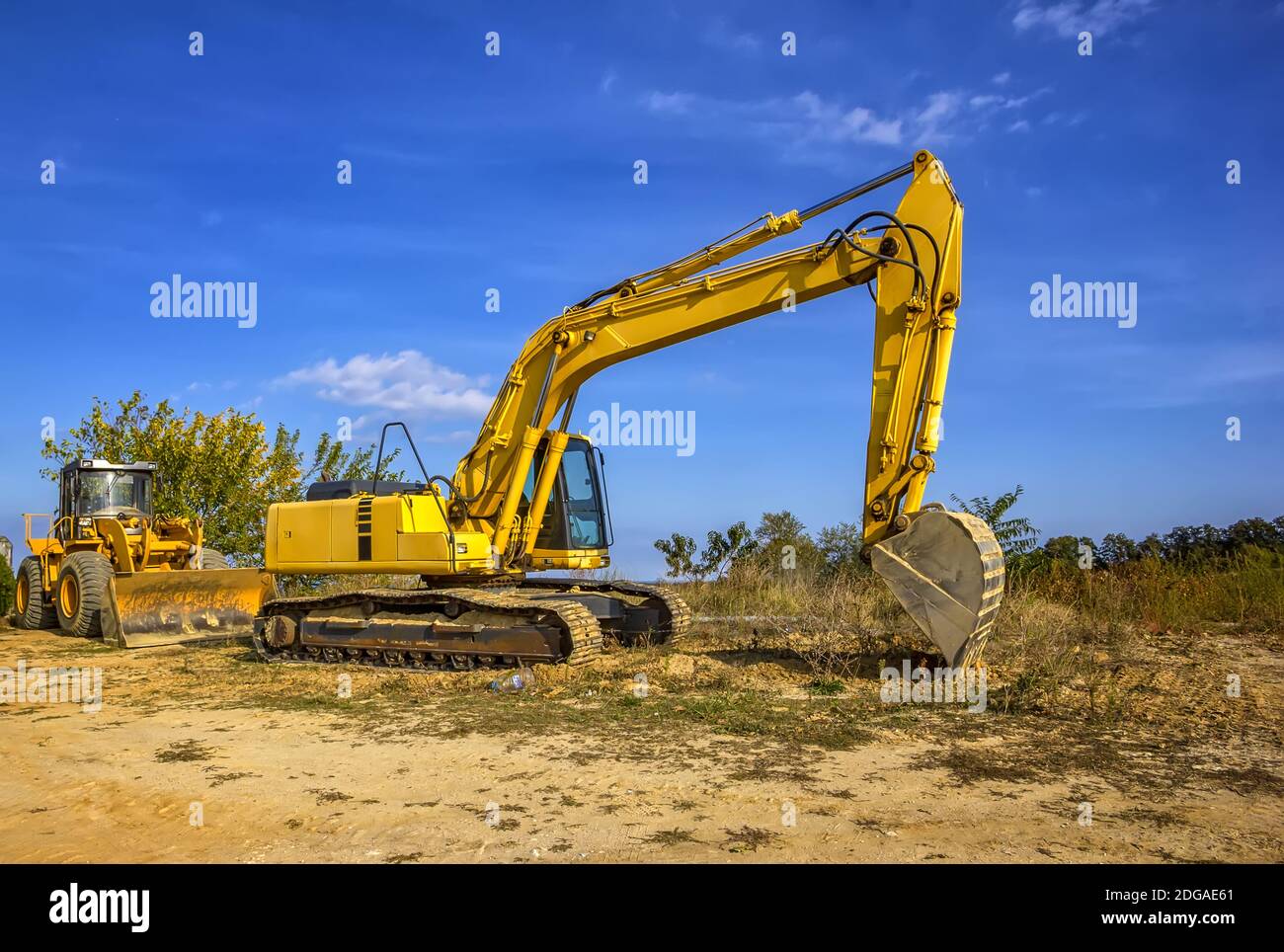 Bulldozer and excavator Stock Photo - Alamy