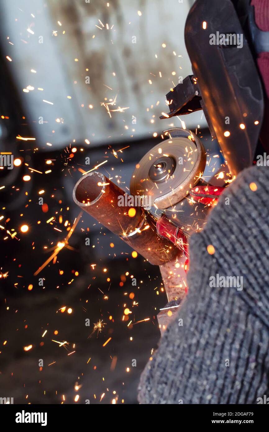 Processing root weld with a cutting machine Stock Photo - Alamy