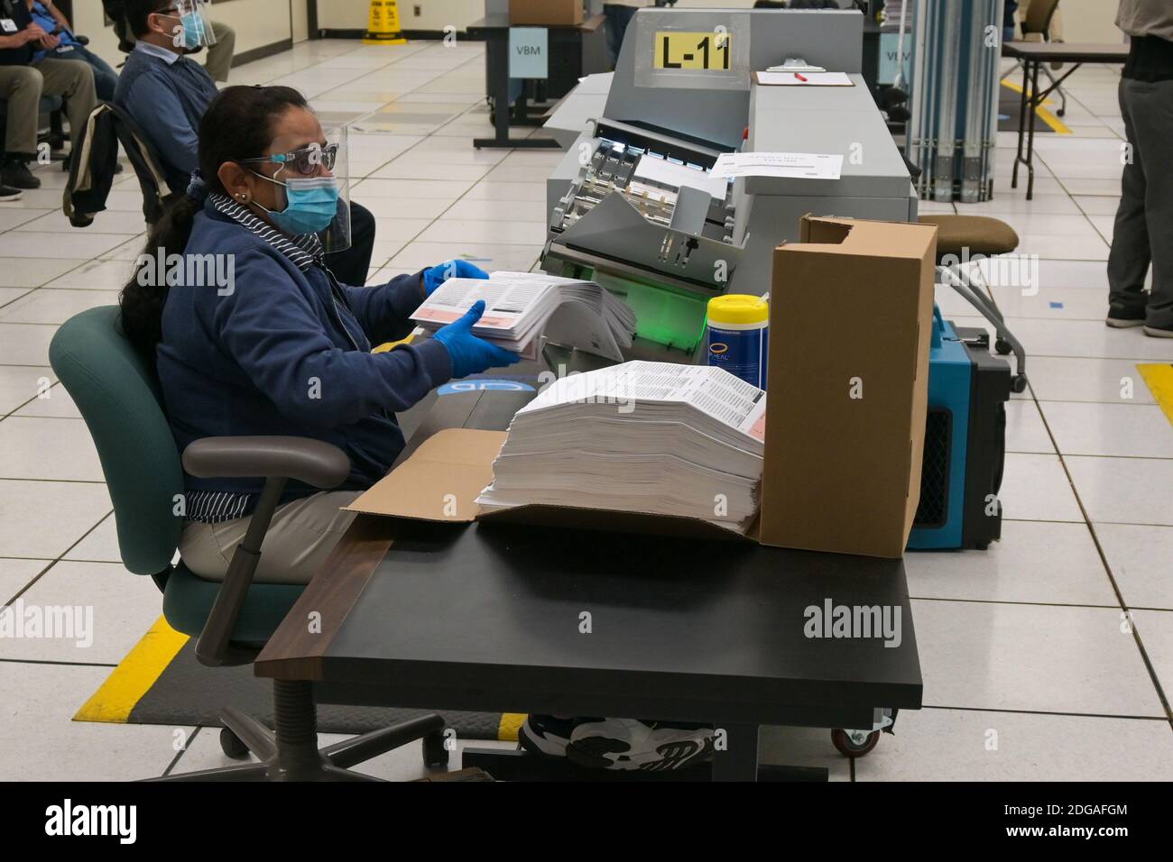 Workers continue to count votes two days after the election at the Los ...