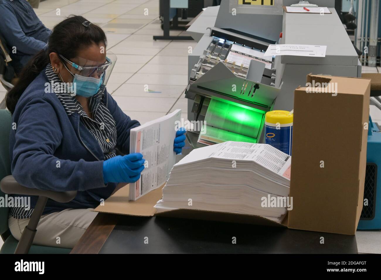 Workers continue to count votes two days after the election at the Los ...