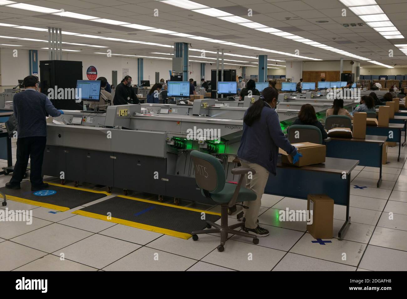 Workers continue to count votes two days after the election at the Los ...