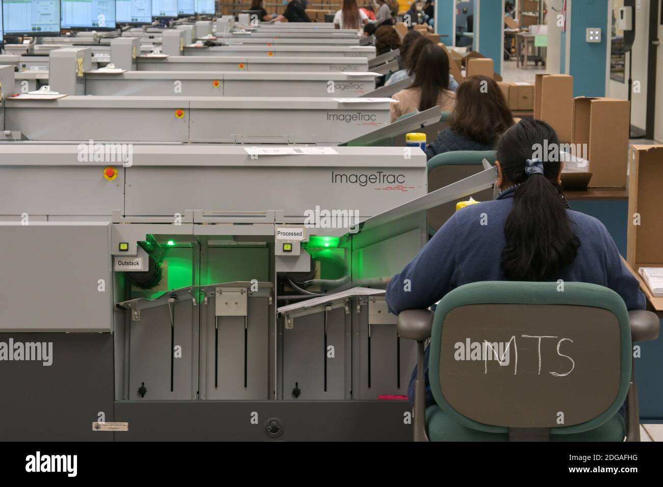 Workers continue to count votes two days after the election at the Los ...