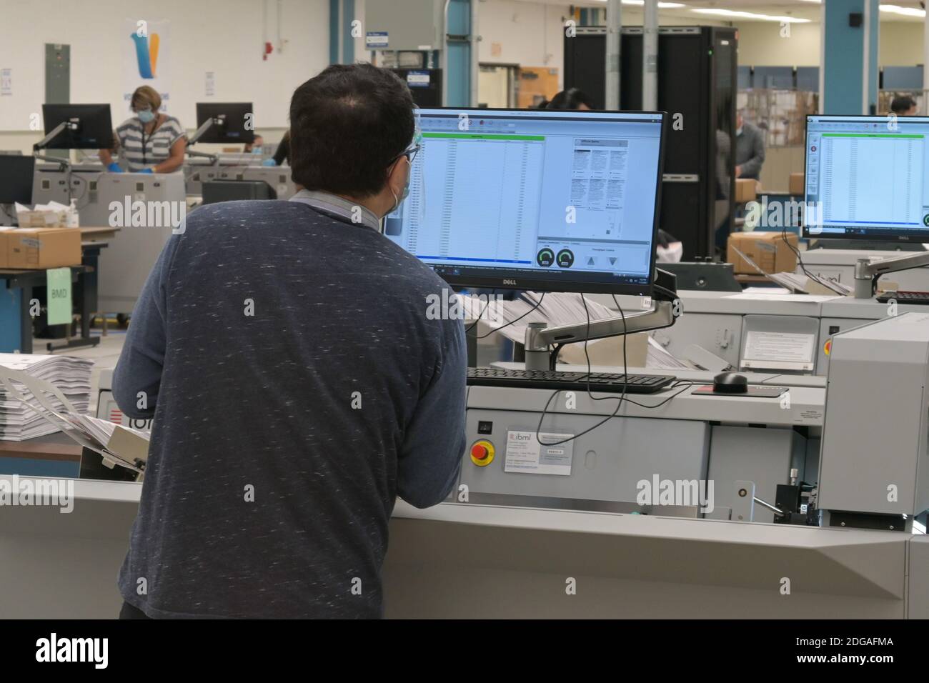 Workers continue to count votes two days after the election at the Los ...