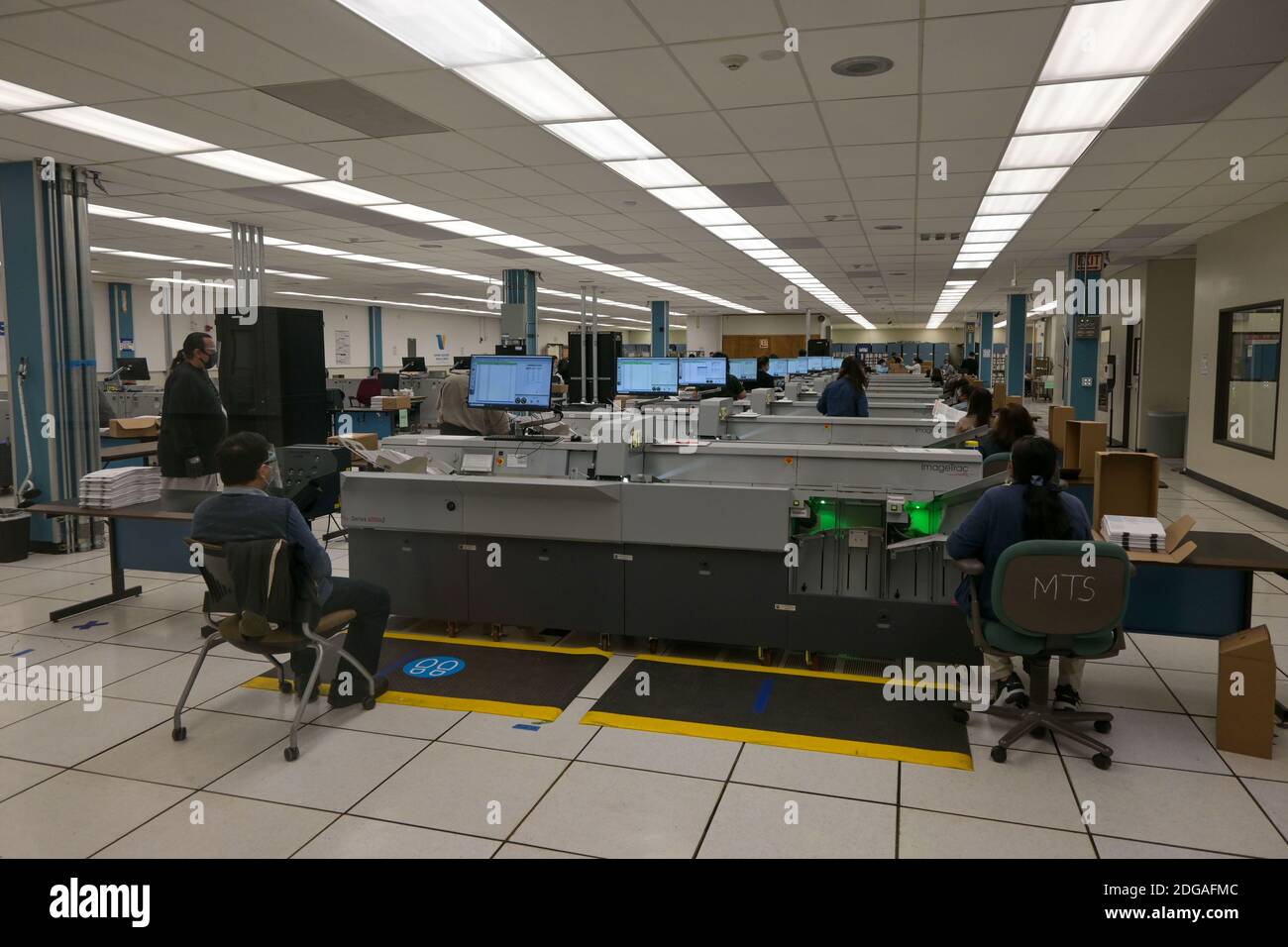 Workers continue to count votes two days after the election at the Los ...