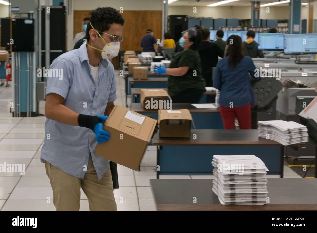 Workers continue to count votes two days after the election at the Los ...
