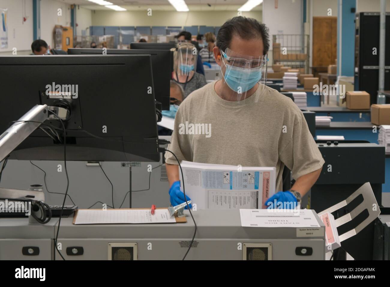Workers continue to count votes two days after the election at the Los ...
