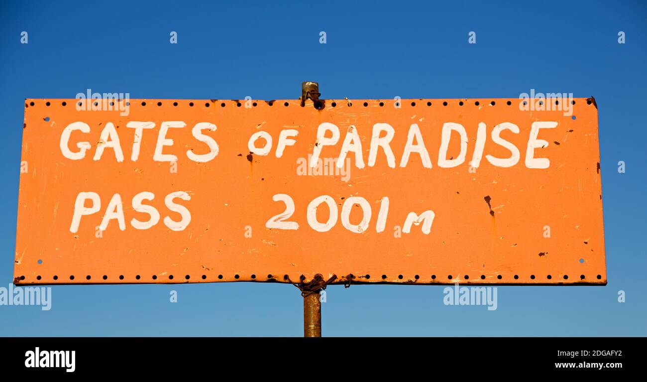 In road sign gate of paradise pass Stock Photo - Alamy