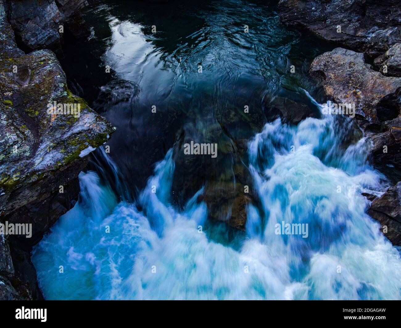 Massive and fast moving water fall in a Norwegian national park. Motion ...
