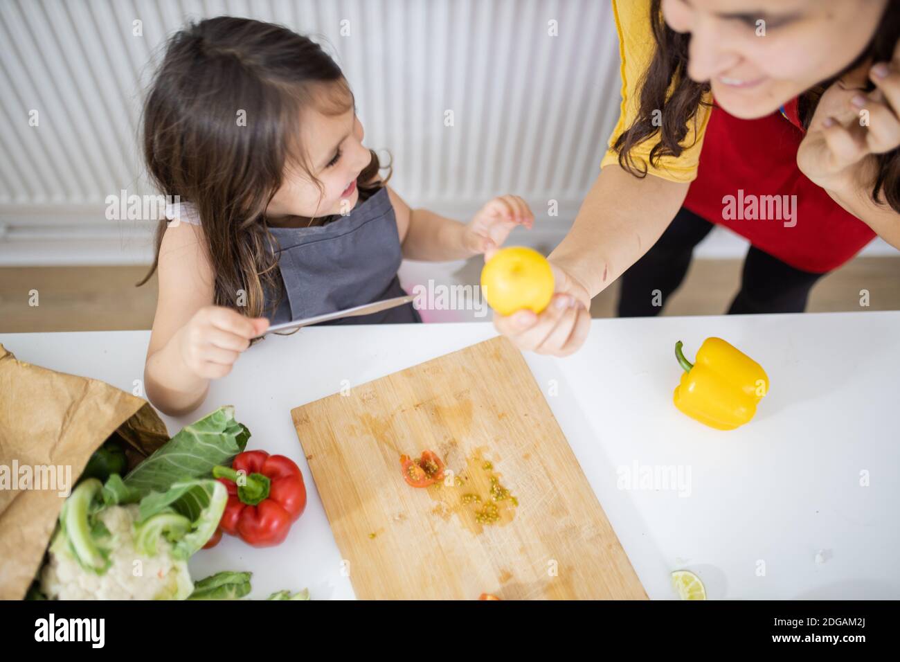 Child cutting vegetables wooden table hi-res stock photography and ...