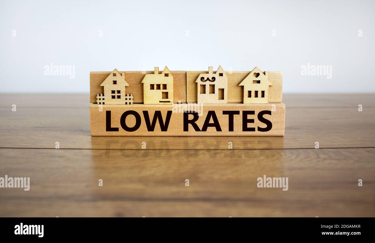 Low rates symbol. Wooden blocks form the words 'low rates', miniature ...