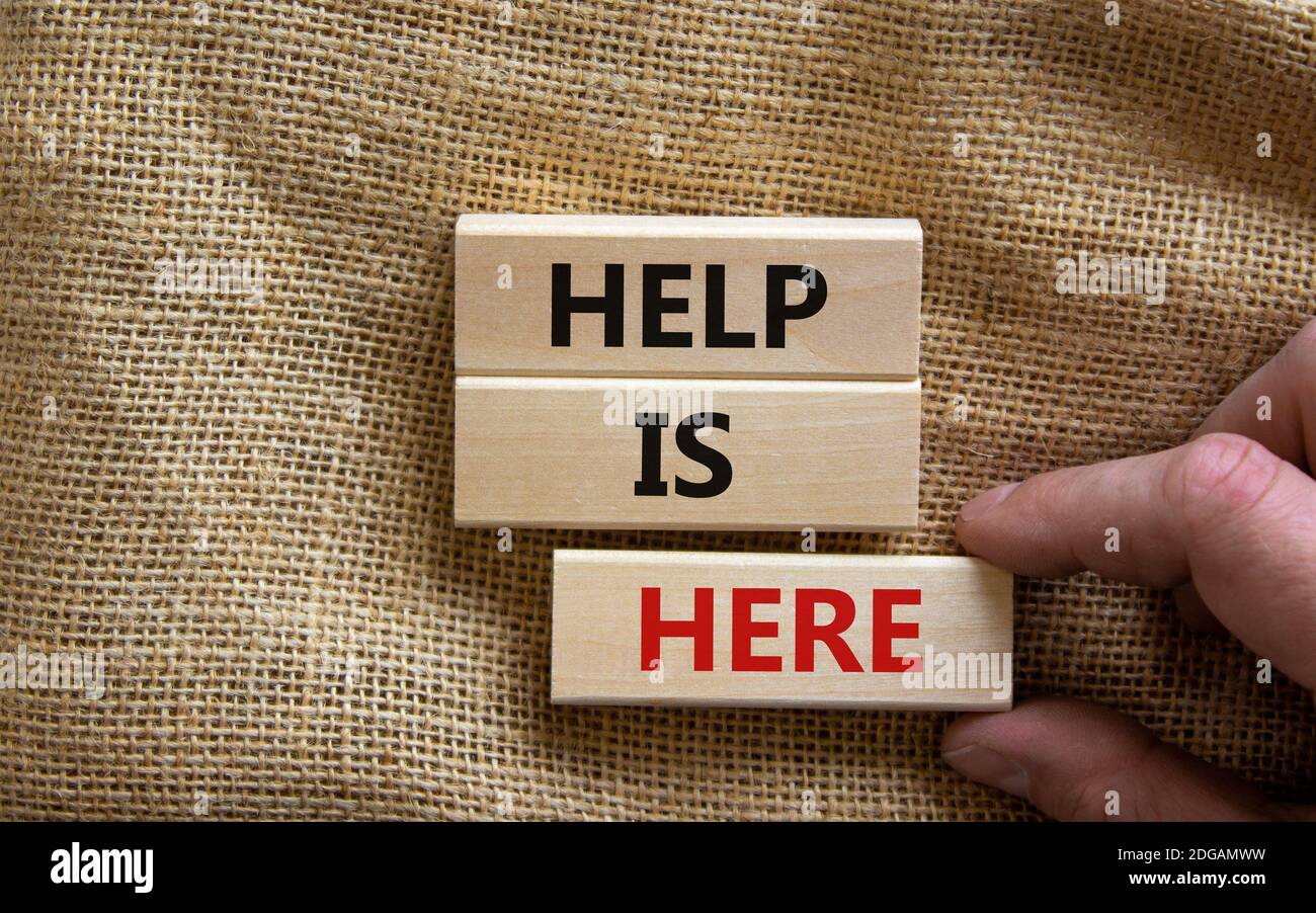Help is here symbol. Wooden blocks with words 'help is here'. Beautiful ...