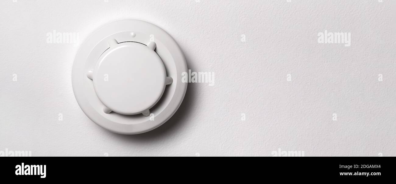 Close-up Of White Smoke Detector On A Ceiling Stock Photo - Alamy