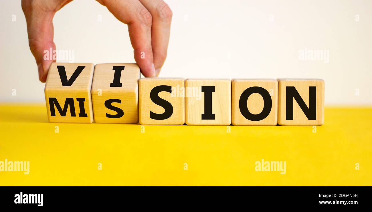Mission vision symbol. Businessman hand turns wooden cubes and changes ...