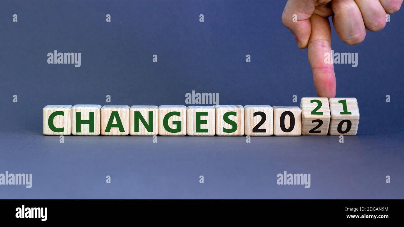 2021 new year changes. Male hand flips wooden cube and changes the ...