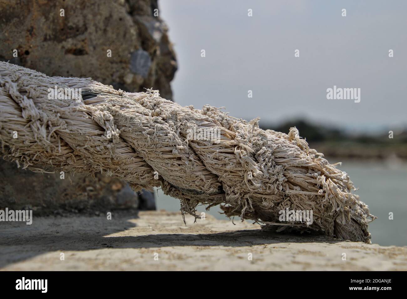The old ropes were tied to cement poles Stock Photo - Alamy