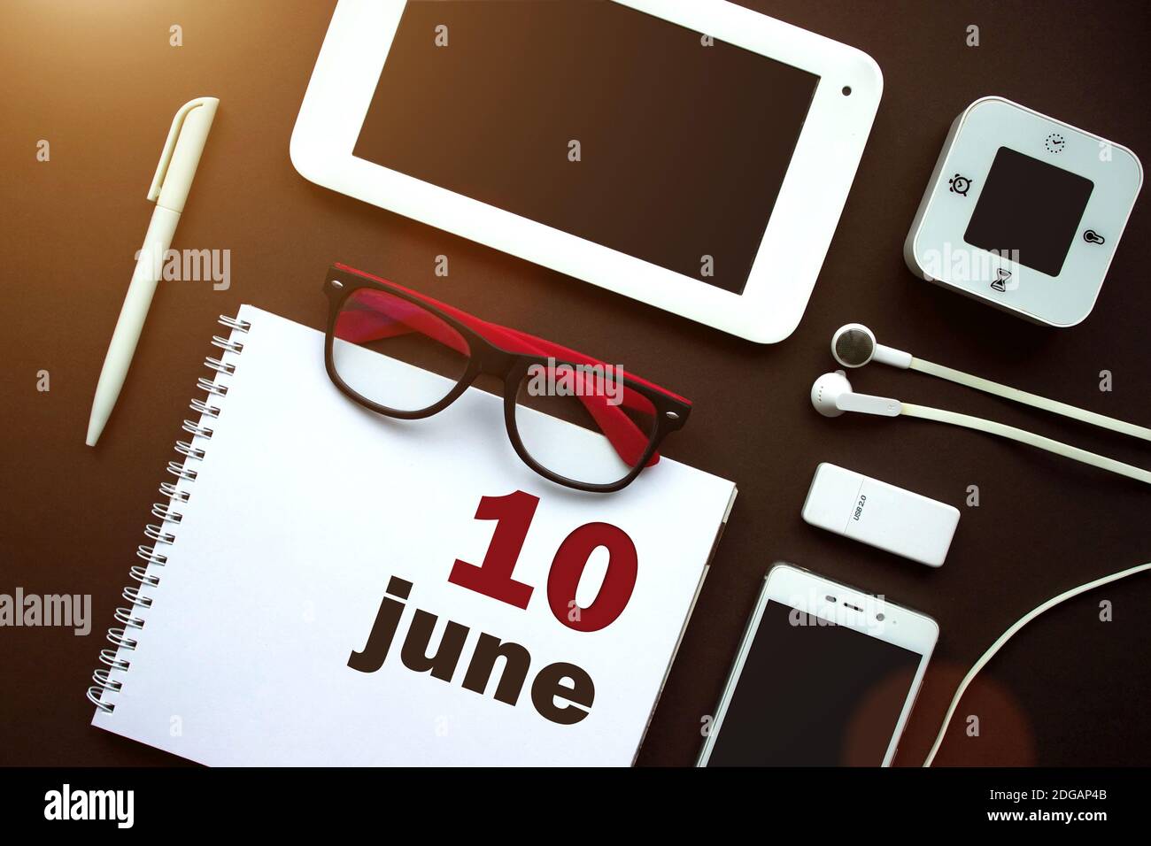 June 10th. Day 10 of month, Calendar date. Office workplace with laptop ...