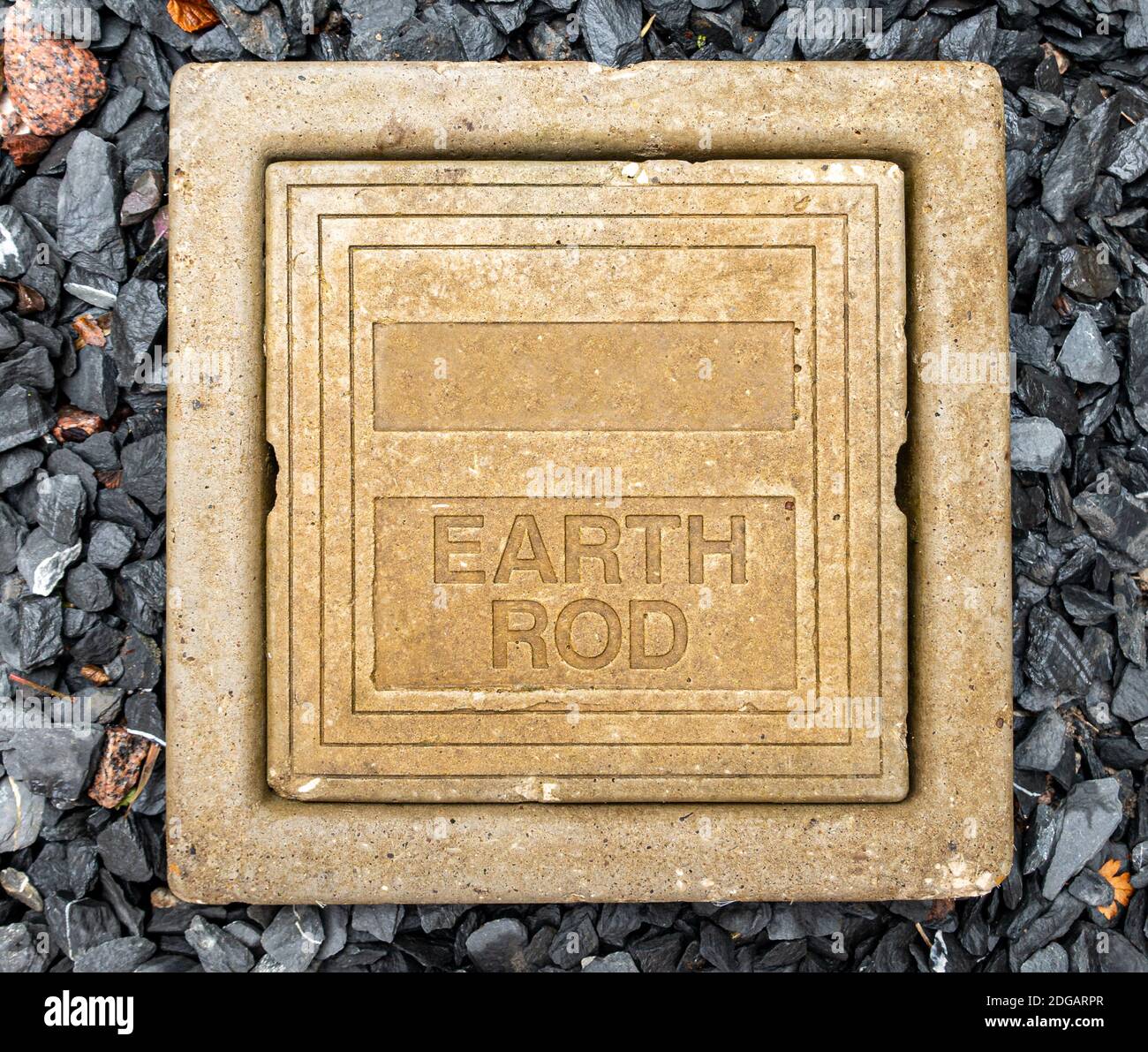 Buried earth rod inspection pit in gravel Stock Photo - Alamy