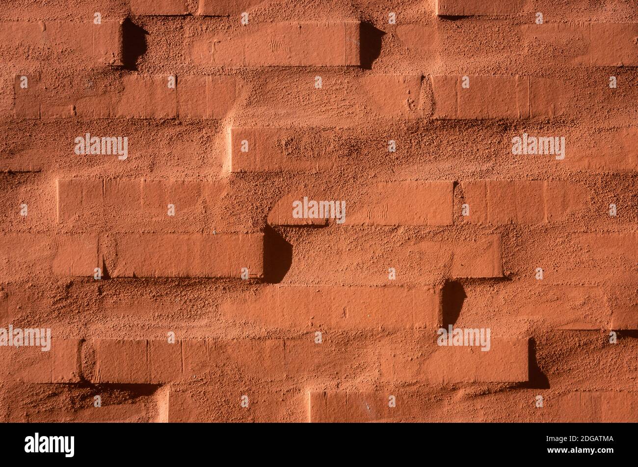 Red plastered brick wall as texture or background Stock Photo - Alamy