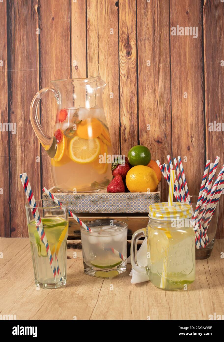 Large glass pitcher with citrus flavored water and homemade lemonade ...