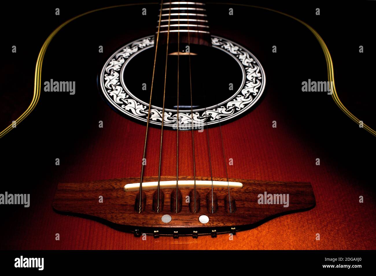 Close up of acoustic guitar on black background Stock Photo - Alamy