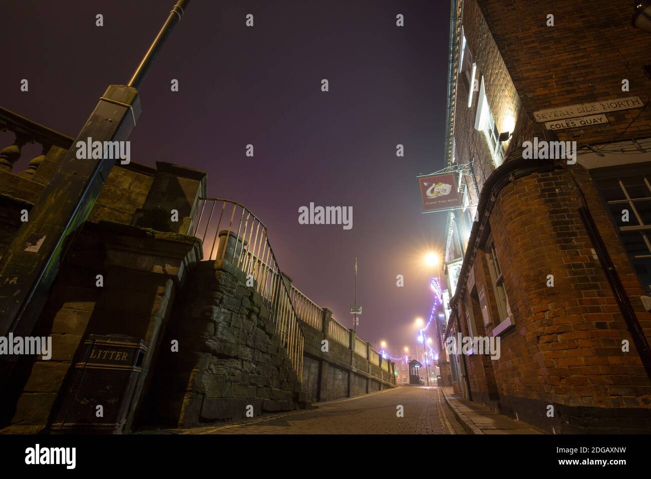 Low pov street view late at night with some Christmas lights Stock ...