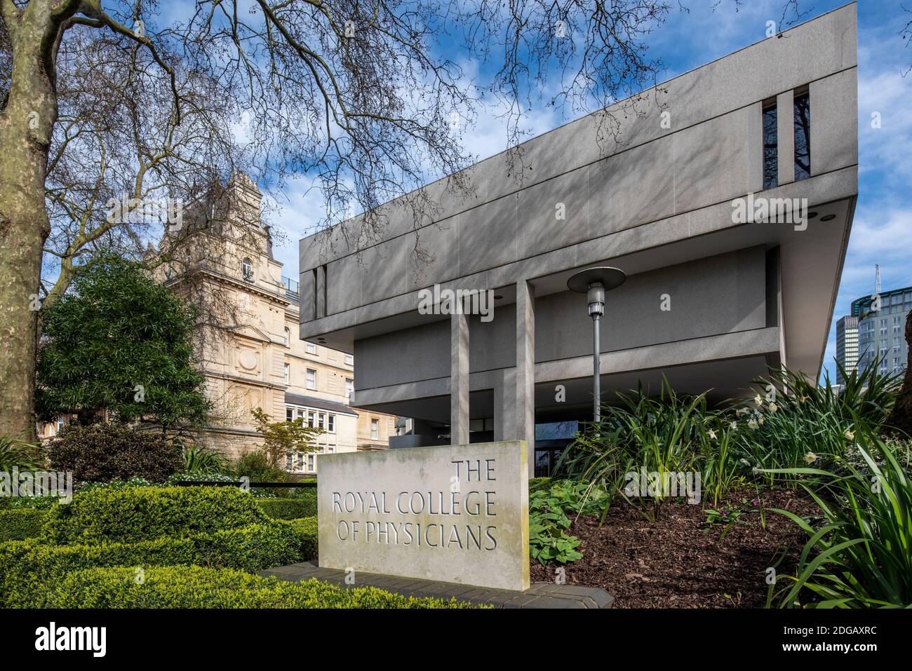 Oblique view of main entrance, west elevation showing building name cut ...