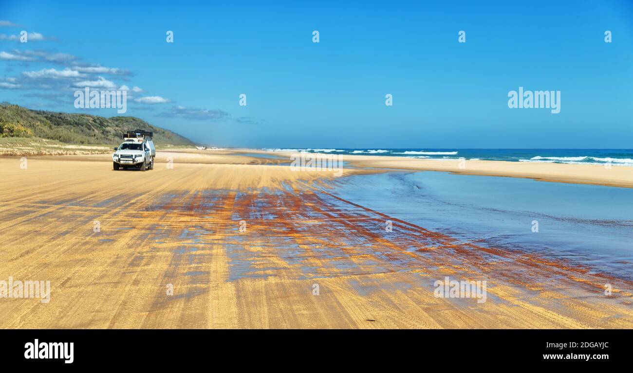 Near the ocean the sand track of the cars Stock Photo - Alamy