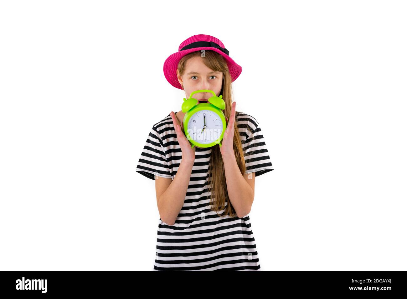 Surprised Girl holding alarm Clock, isolated on white background ...