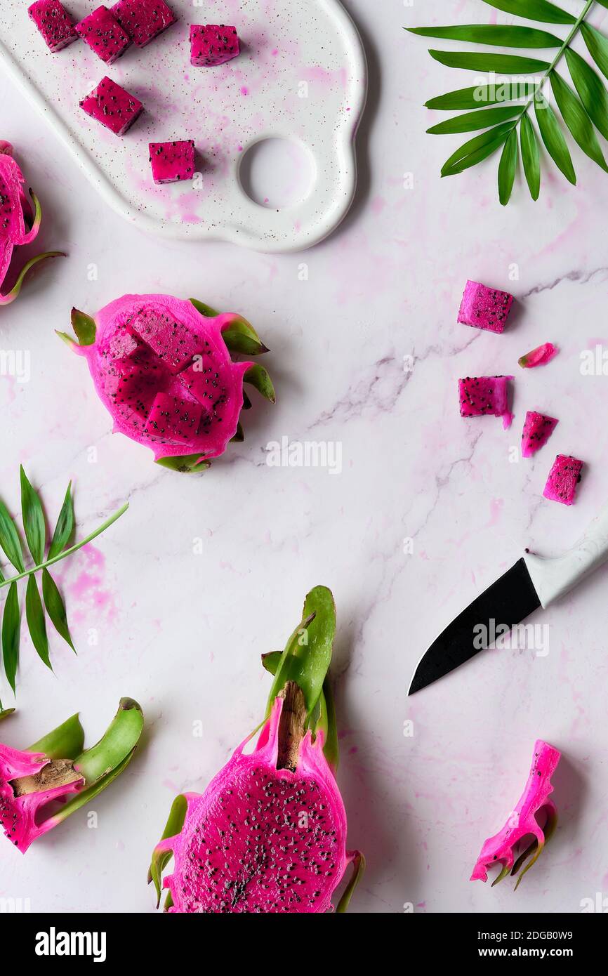 Ugly food. Juicy pink dragon fruit, pitaya, pitahaya sliced on marble ...