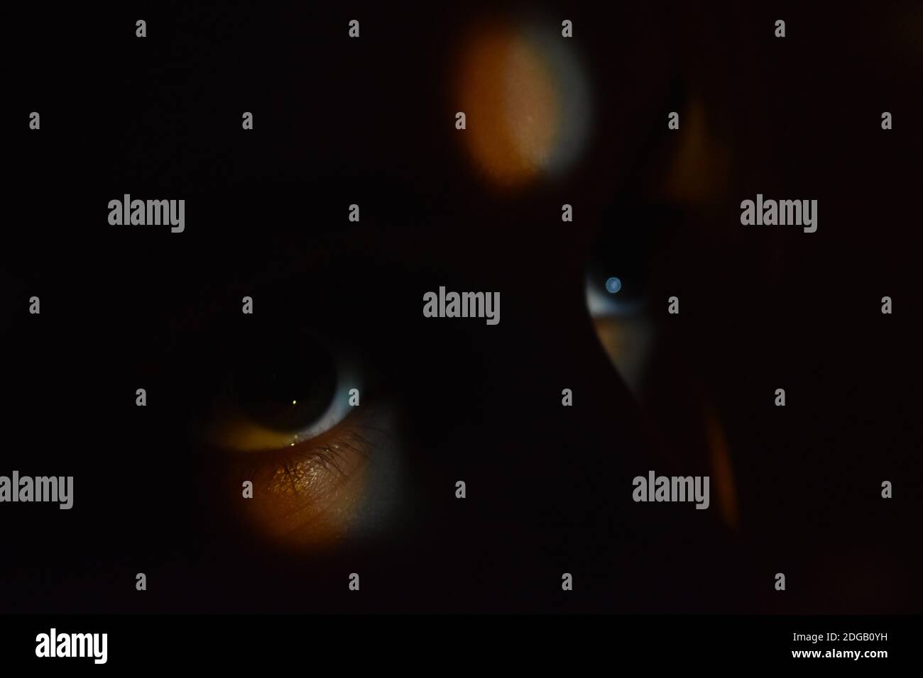 A mysterious look of a child in the darkness Stock Photo - Alamy