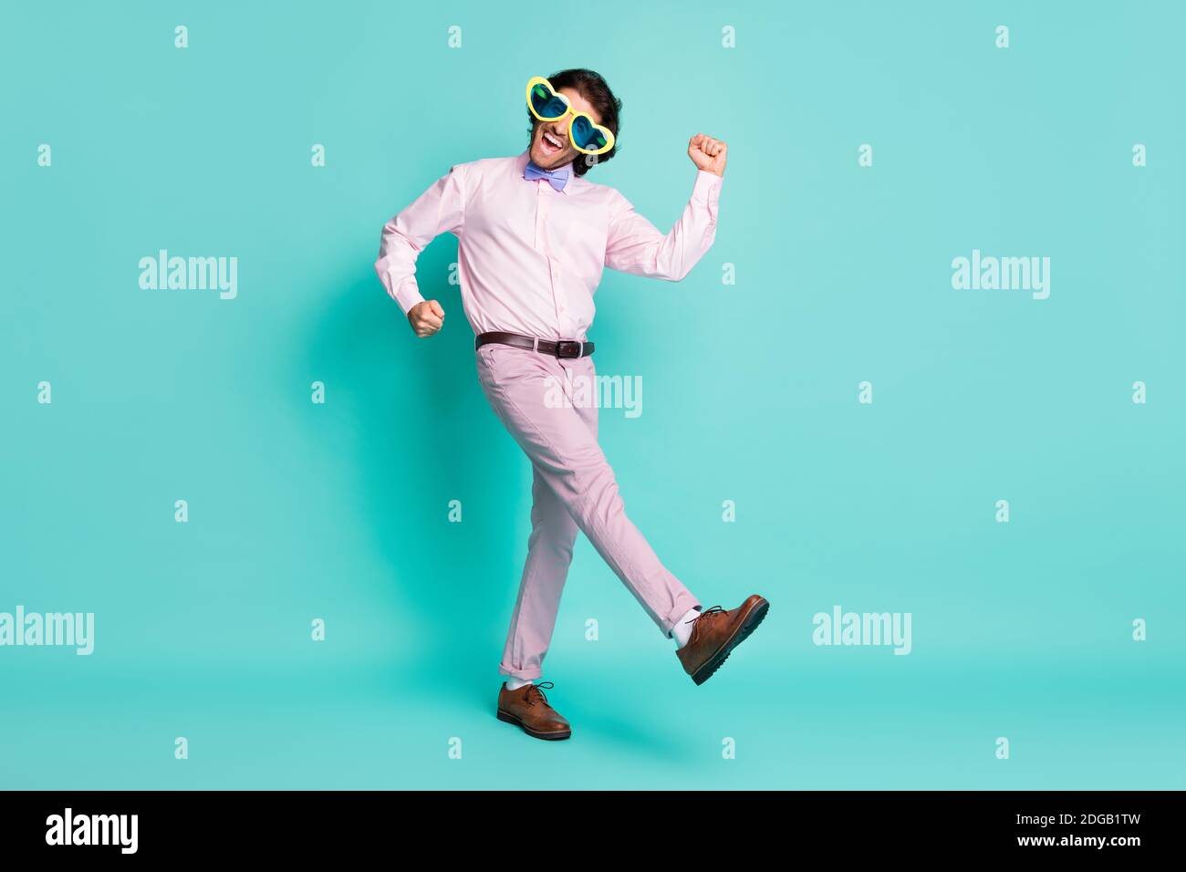 Full length photo of happy dancing young man wear formal outfit sun ...