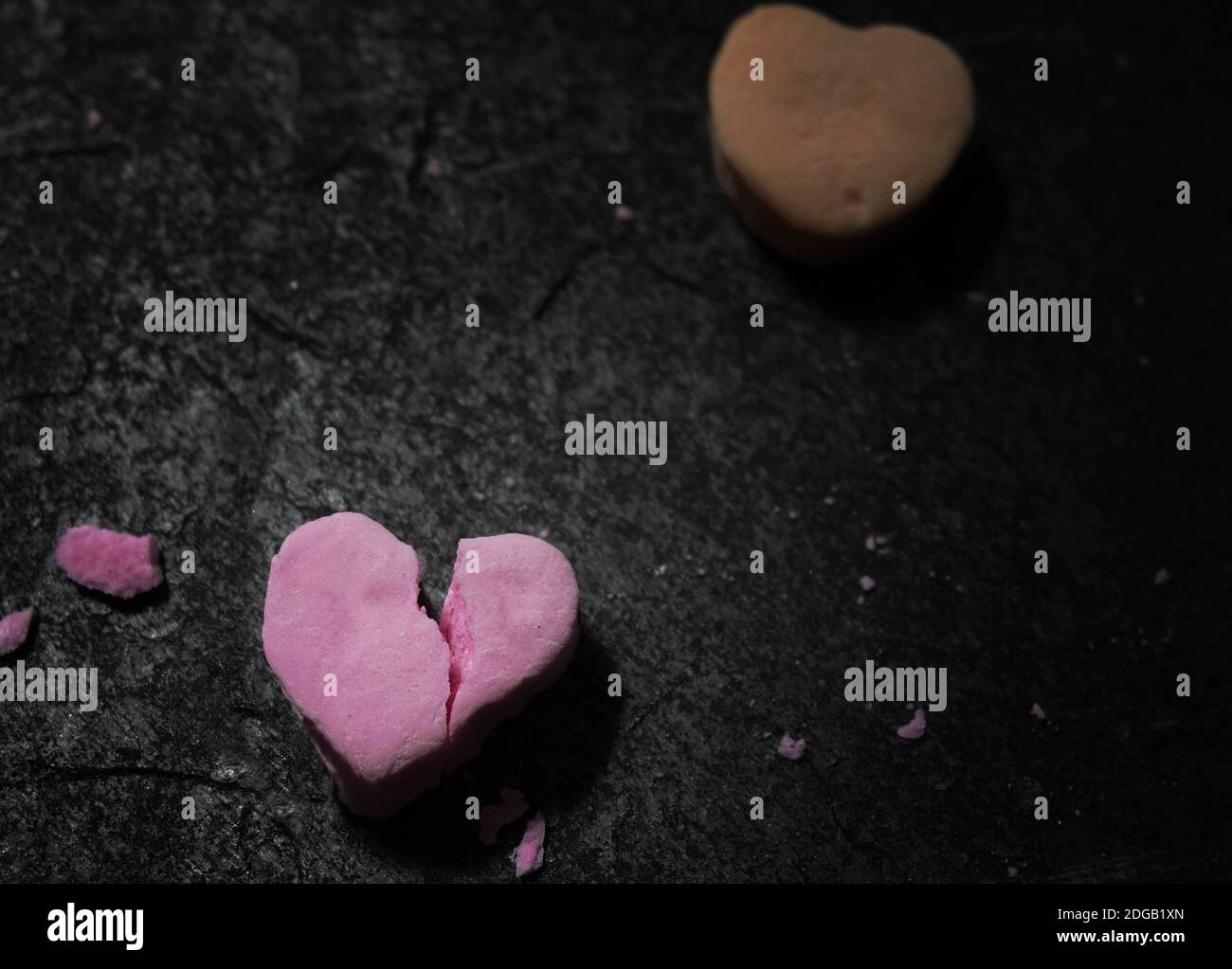 Broken heart candy Stock Photo - Alamy