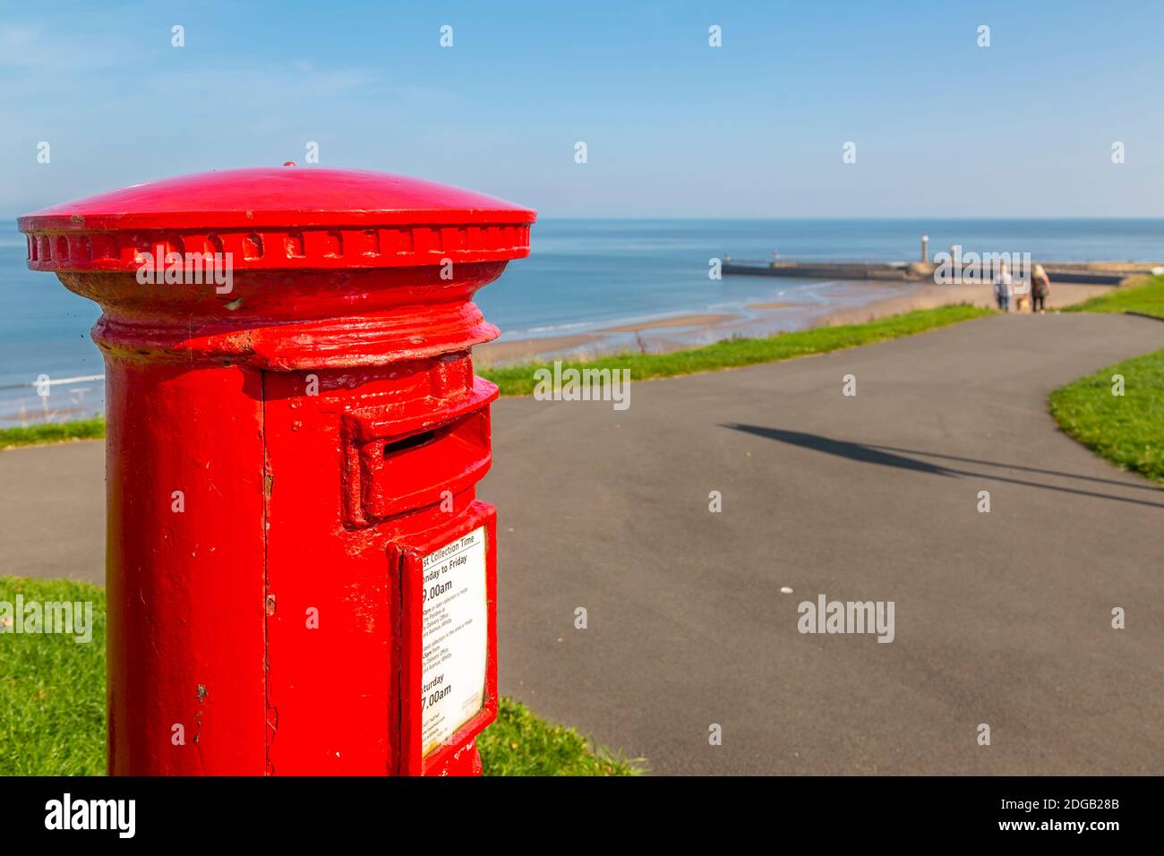View of traditional red post box and West Cliff Beach, Whitby, North ...