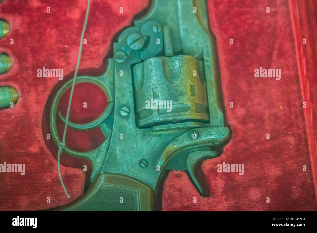 Old short revolver gun on red box background. Vintage old pistol ...