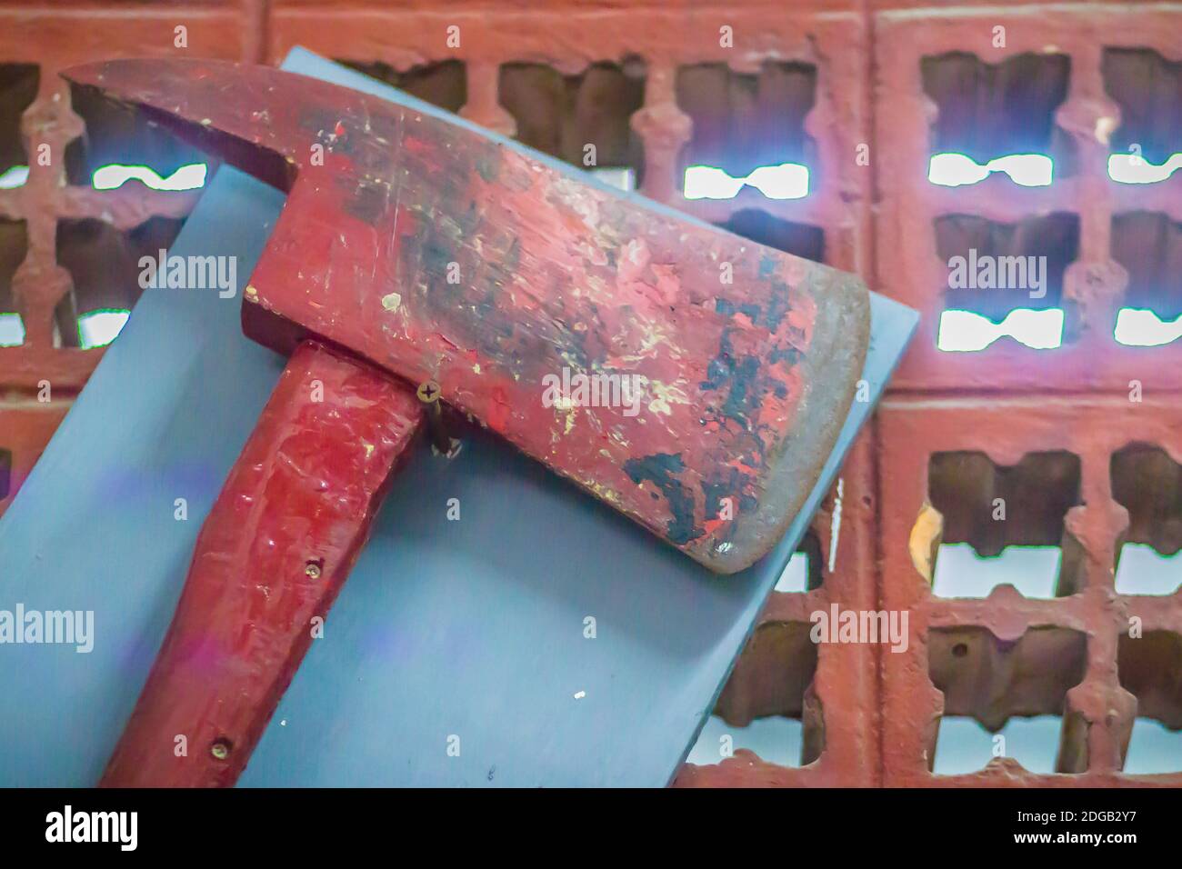 Old red fire fighting ax hanging on the wall. Fire ax is one of the ...