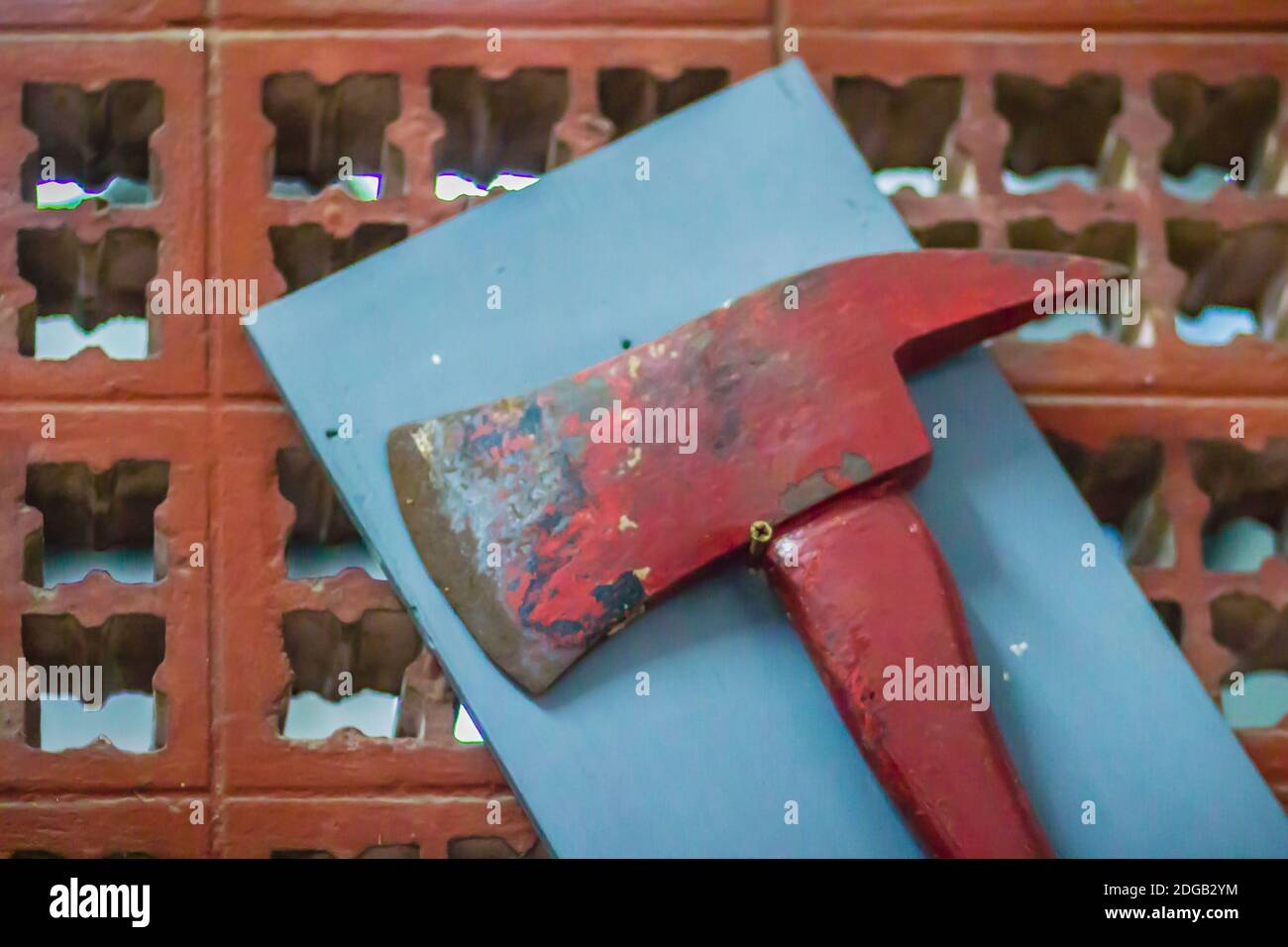 Old red fire fighting ax hanging on the wall. Fire ax is one of the ...