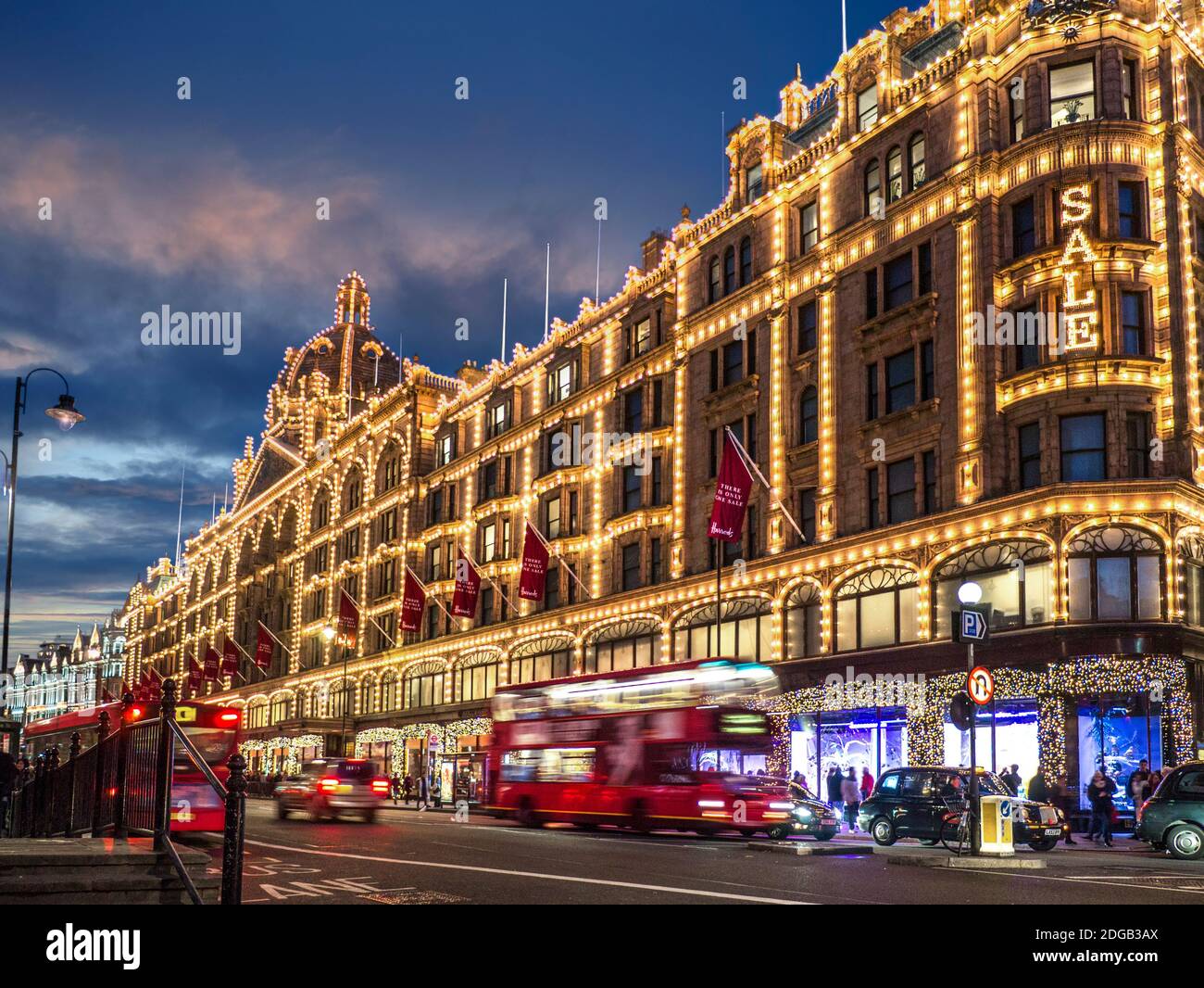 SALE Harrods winter sales lights sunset department store lit up at dusk ...