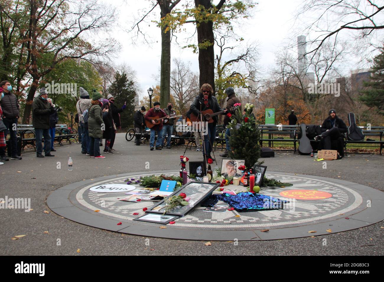 New York, USA. 08th Dec, 2020. Photos, flowers and candles are on ...
