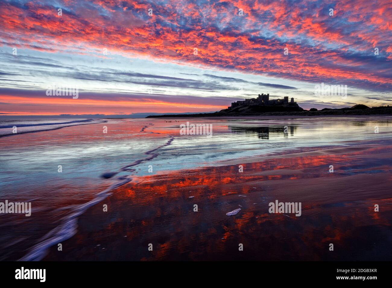 Bamburgh castle northumberland waves people hi-res stock photography ...