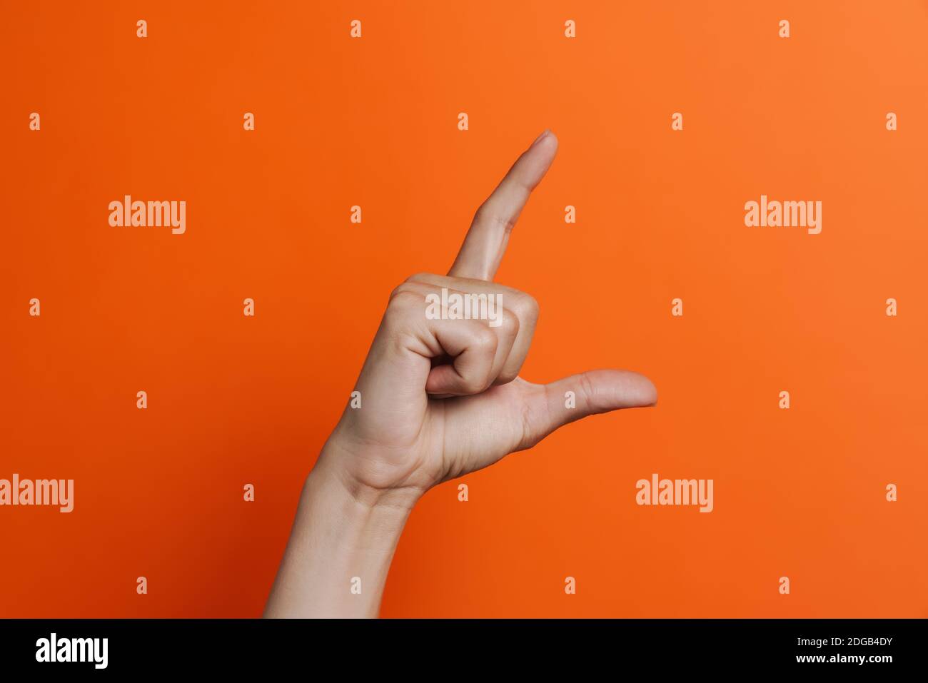 Woman s hand showing little amount isolated Stock Photo - Alamy