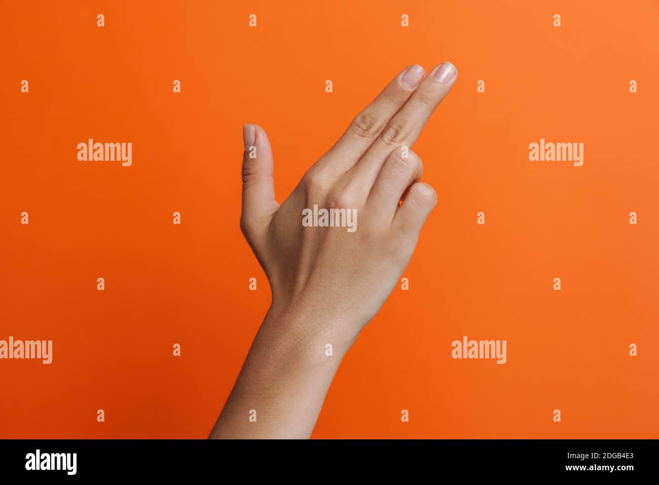Woman's hand pointing away isolated Stock Photo - Alamy