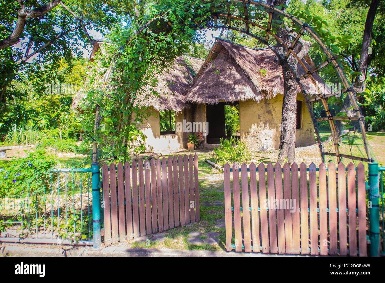 Earthen house under shade of trees. An earth house, also known as earth ...